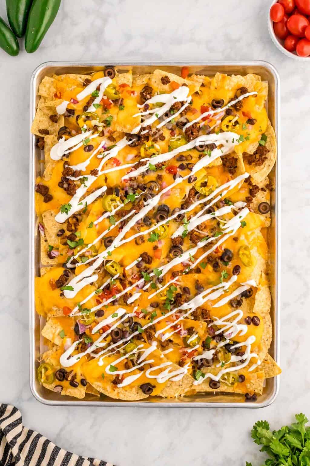 Cheesy Sheet Pan Nachos (With Homemade Cheese Sauce!)