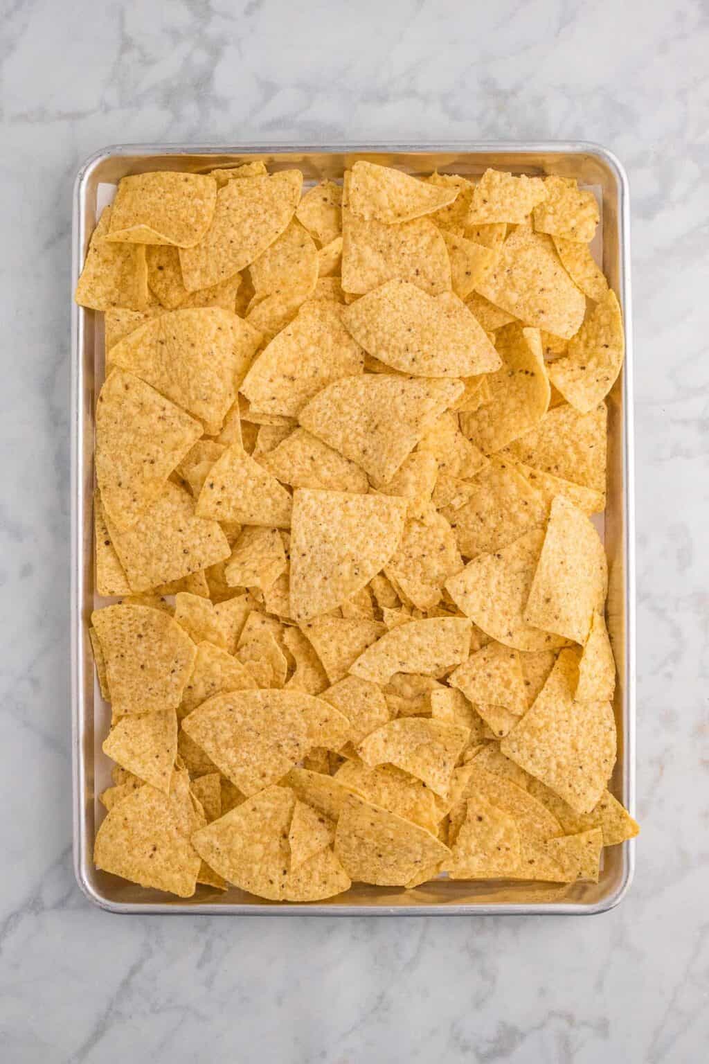 Cheesy Sheet Pan Nachos (With Homemade Cheese Sauce!)